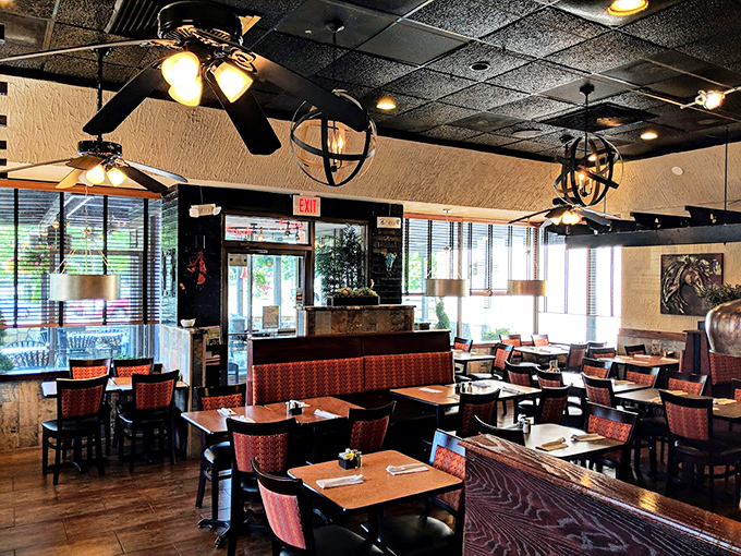 Inside, ceiling fans lazily spin above wooden tables and Southwestern-inspired decor, creating that perfect "come as you are, stay as long as you like" atmosphere.