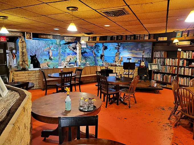 Where literature meets lunch. Bookshelves, wildlife murals, and that unmistakable orange floor create an atmosphere that's equal parts Hemingway and home cooking.