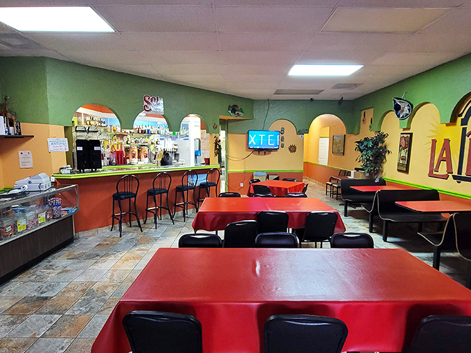 The vibrant green and yellow walls aren't just decoration—they're a preview of the colorful flavor fiesta about to happen on your plate.