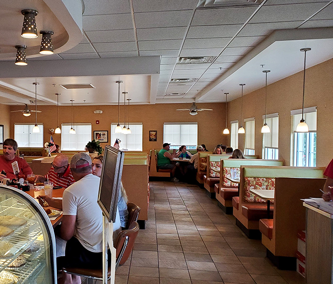Inside, the warm glow of pendant lights illuminates booths where memories are made and coffee cups are never empty.