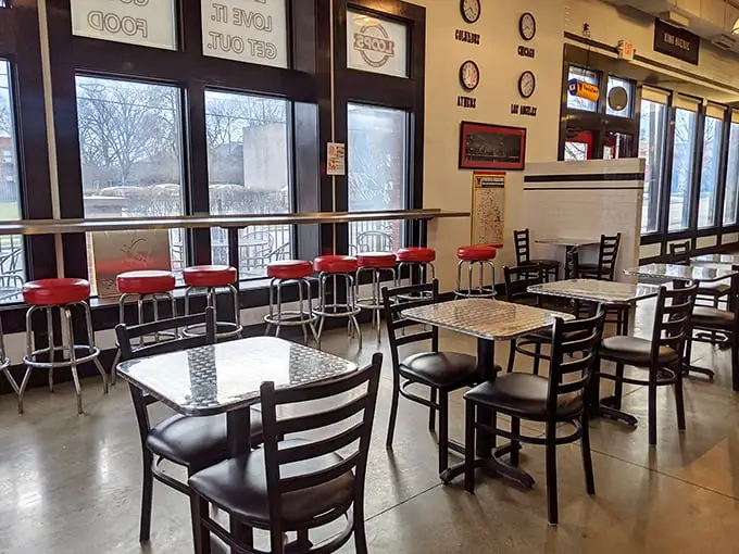 Simple tables, red bar stools, and zero pretension – the dining room at Loops follows the universal truth that inverse relationship between décor budget and food quality.
