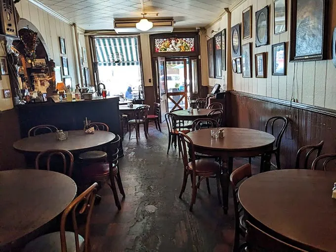 Step inside and time stands still—bentwood chairs, worn wooden floors, and walls that could tell a century of stories if they could talk.