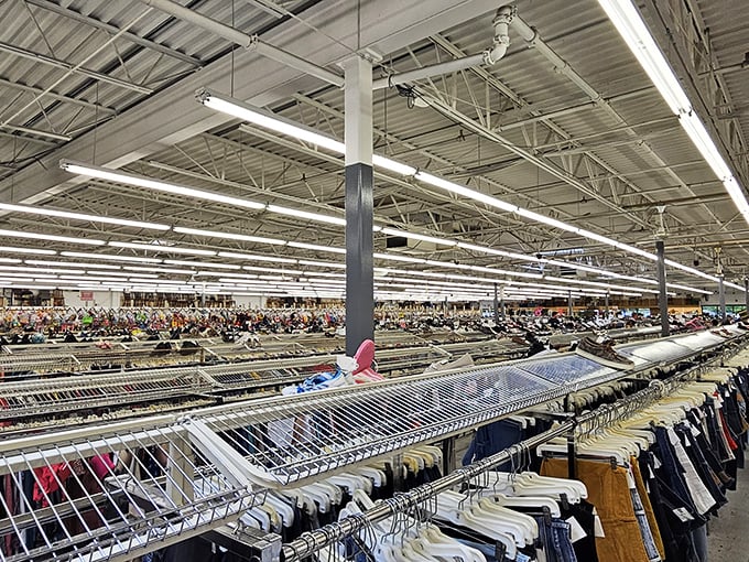 Endless racks stretch toward retail infinity. This isn't just a clothing section—it's a textile galaxy where fashion from every decade awaits rediscovery.