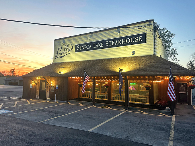 Bella's wooden exterior at sunset—where Finger Lakes magic meets meat mastery. Napa Valley, eat your heart out.