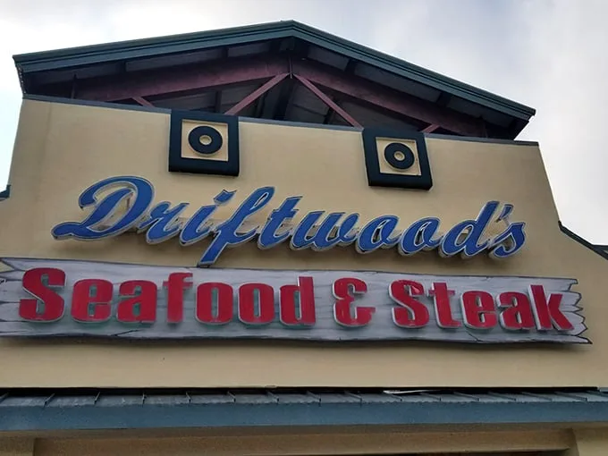 Driftwoods' sign tells you exactly what you're in for – seafood AND steak perfection. No need to choose between surf and turf here.