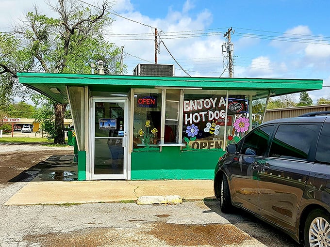 Hand-painted promises of "BEST HOT DOGS IN TOWN" that aren't just marketing – they're a mission statement in technicolor.