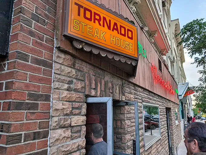 Walking into Tornado Steak House feels like stepping into a delicious time capsule where martinis are strong and steaks are serious.