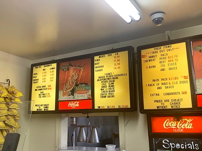 The menu board tells you everything you need to know—meat by the pound and family packs that could feed a Little League team.