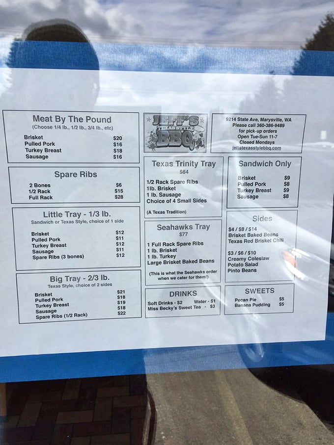 The menu reads like barbecue poetry—brisket, ribs, pulled pork. Notice the "Texas Trinity Tray"—a holy combination that would make even the most devout meat-lover speak in tongues.