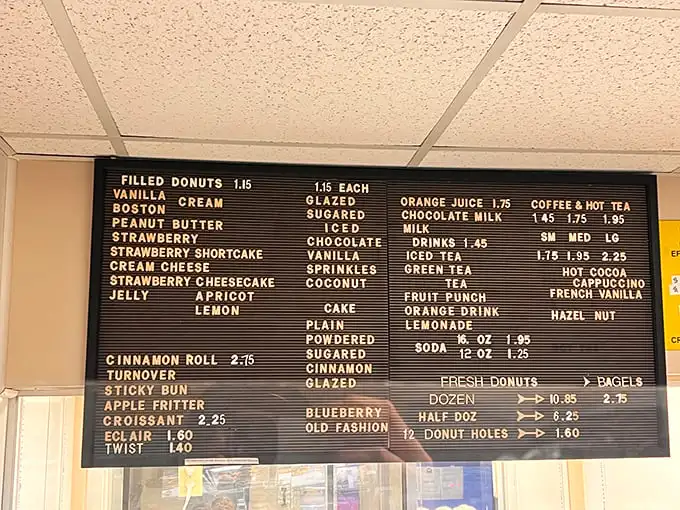 This menu board is like the Rosetta Stone of fried dough delights. Decode it early or miss out on the good stuff.
