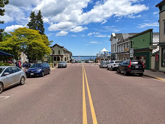 Main Street's gentle slope creates the perfect reveal: shops and cafés leading your eye straight to that magnificent Great Lakes horizon.