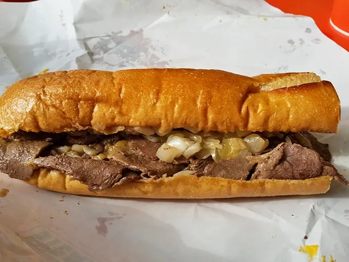Behold the object of desire: thinly sliced ribeye cradled in a perfect Amoroso roll with the melted onions playing their crucial supporting role.