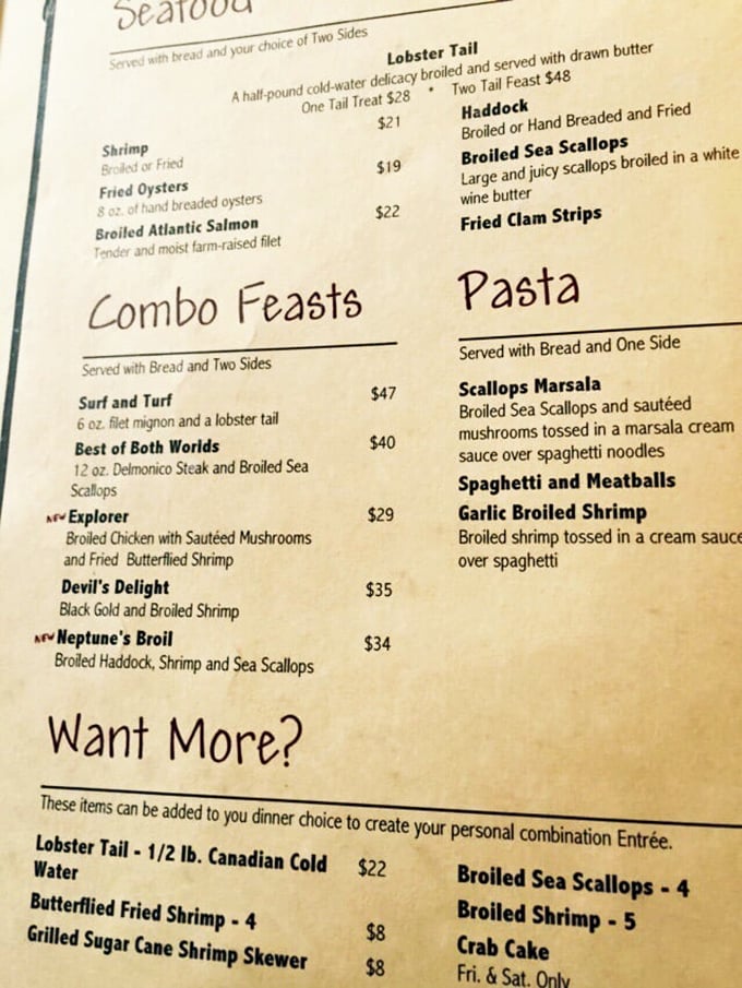 The menu reads like a love letter to carnivores. "Want More?" isn't a question – it's a challenge your stomach happily accepts.