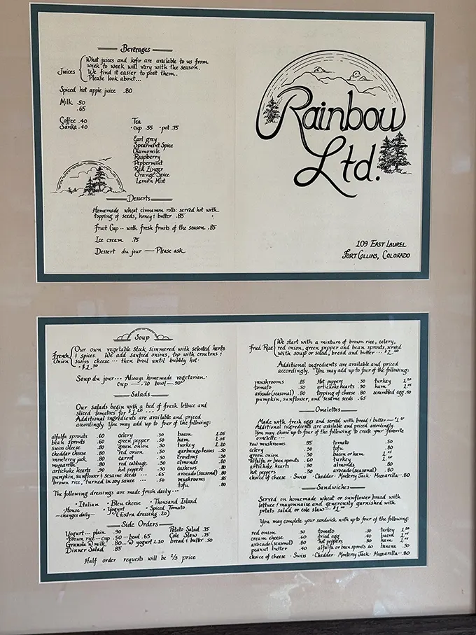 A vintage menu that tells stories of meals past. Notice the hand-drawn rainbow logo—a charming throwback to simpler, delicious times.