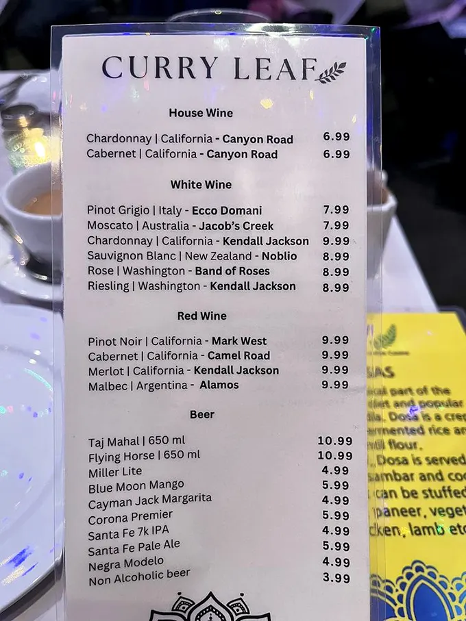 The wine list reads like a global passport—from California Chardonnay to Argentinian Malbec, perfect companions for your spice journey.