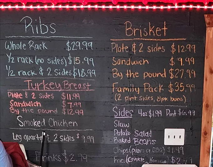 The chalkboard menu tells you everything you need to know about priorities here – no fancy fonts, just a direct path to smoked meat nirvana.