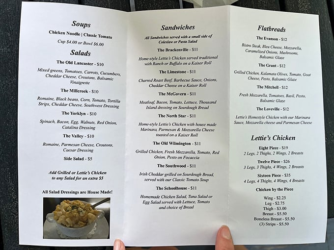 A menu that reads like a love letter to comfort food classics, with sandwiches named after local landmarks and chicken that's available by the piece—genius!