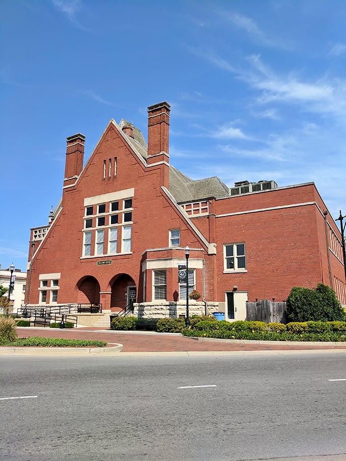 This stately red brick courthouse isn't just architecture—it's the beating heart of a community that values both tradition and a good story.