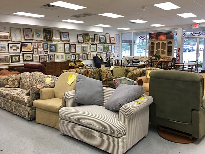 A showroom where sofas of every era congregate—from mid-century modern to "grandma's plastic-covered special"—all priced less than a fancy dinner for two.
