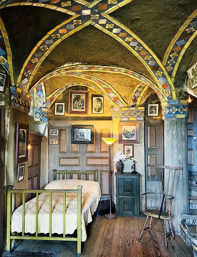 The bedroom that launched a thousand Pinterest boards. Medieval-meets-Arts-and-Crafts with a ceiling that makes counting sheep utterly unnecessary.