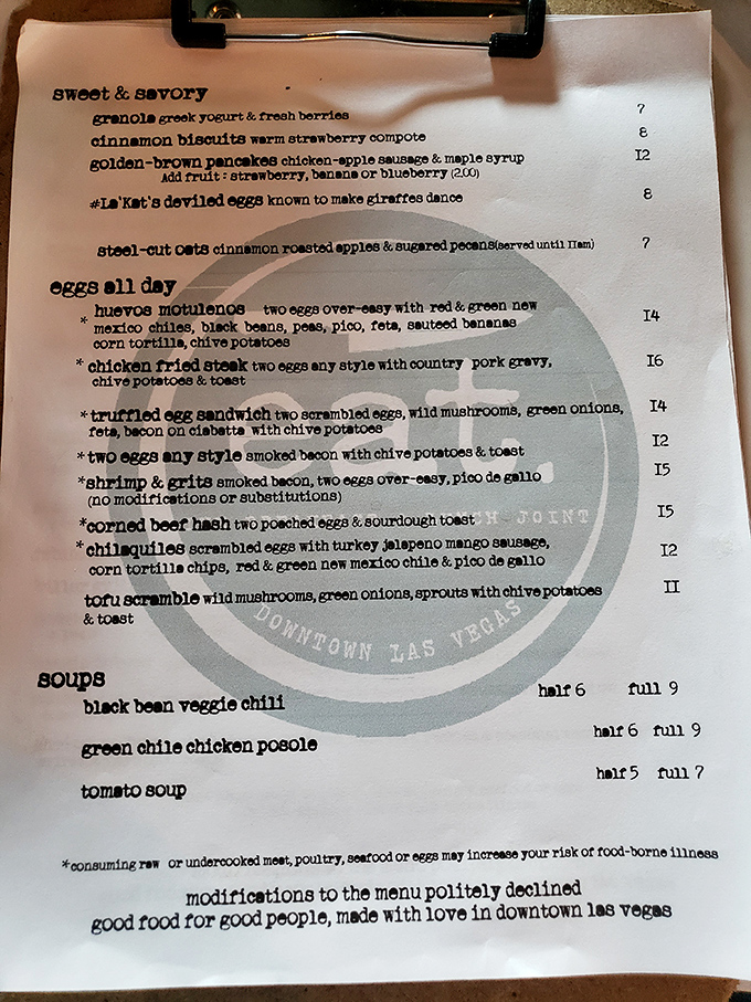 A menu that refuses to ramble yet somehow says everything. Note the playful warning about those deviled eggs—apparently giraffes aren't the only ones who'll dance after trying them.