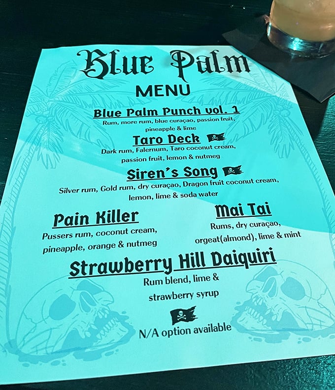 The menu glows with possibility – each cocktail name promising a mini-vacation in liquid form. The Pain Killer isn't lying.