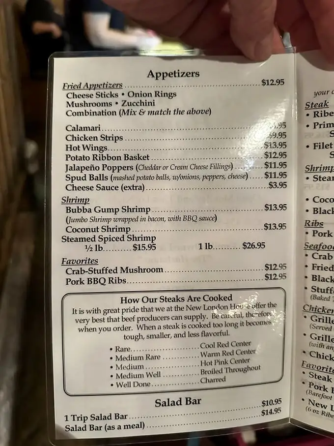 The menu reads like a love letter to carnivores, with detailed steak doneness descriptions that border on poetry.