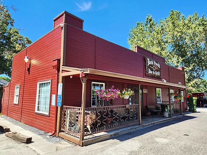 Jacksonville Porch Bar & Grill beckons with its frontier-red façade and inviting porch. The flowers say "come for brunch," the rustic charm says "stay for dinner."