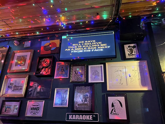 Every square inch tells a story here—the wall gallery creates a visual mixtape spanning decades of Oklahoma City memories.