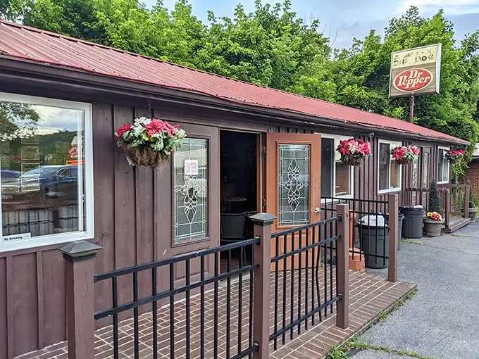 The Dip Dog Stand's rustic charm and hanging flower baskets—proof that hot dog paradise can look like a fairy tale cottage.