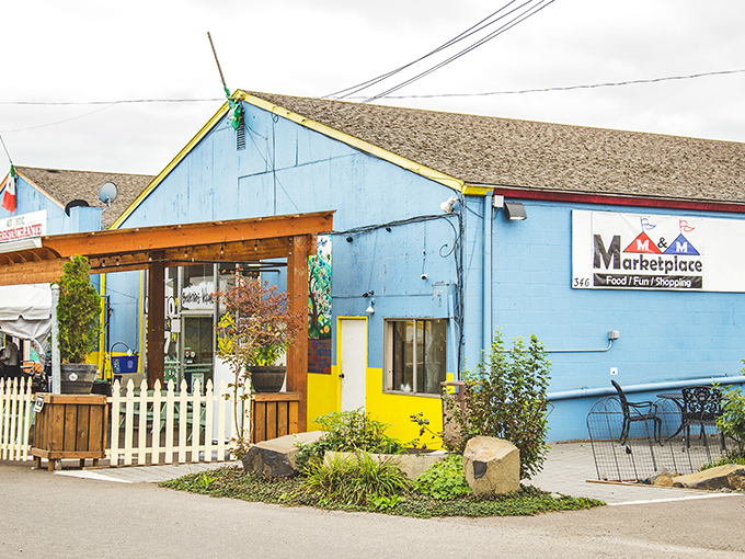 M&M Marketplace's cheerful blue exterior hints at the vibrant cultural kaleidoscope waiting inside—a passport-free international adventure.