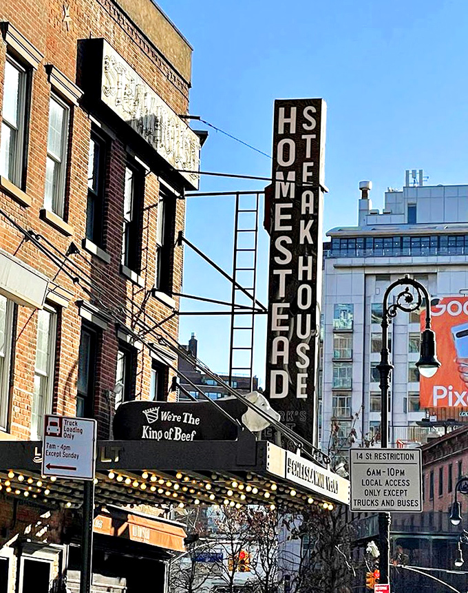 Old Homestead's iconic vertical sign—a meat lighthouse guiding hungry souls through the Meatpacking District since before Instagram was a thing.
