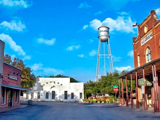 Gruene's water tower watches over the town like a faithful sentinel, keeping time while the dance hall swings below.