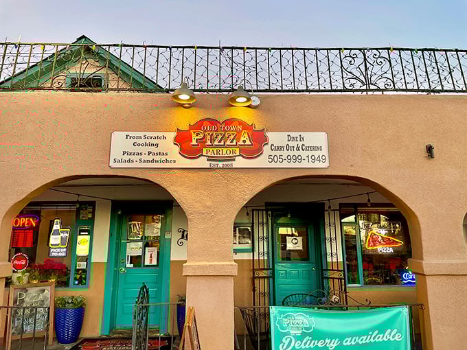 Those turquoise doors aren't just pretty – they're portals to pizza paradise tucked into Old Town's historic charm.