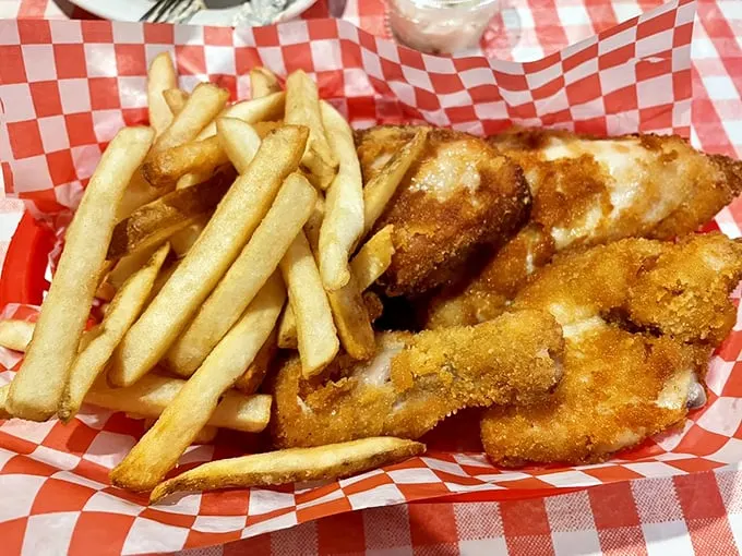Golden-brown perfection meets crispy French fries in this basket of joy. The chicken's crust shatters with each bite, revealing juicy meat that makes you question all other fried chicken experiences.