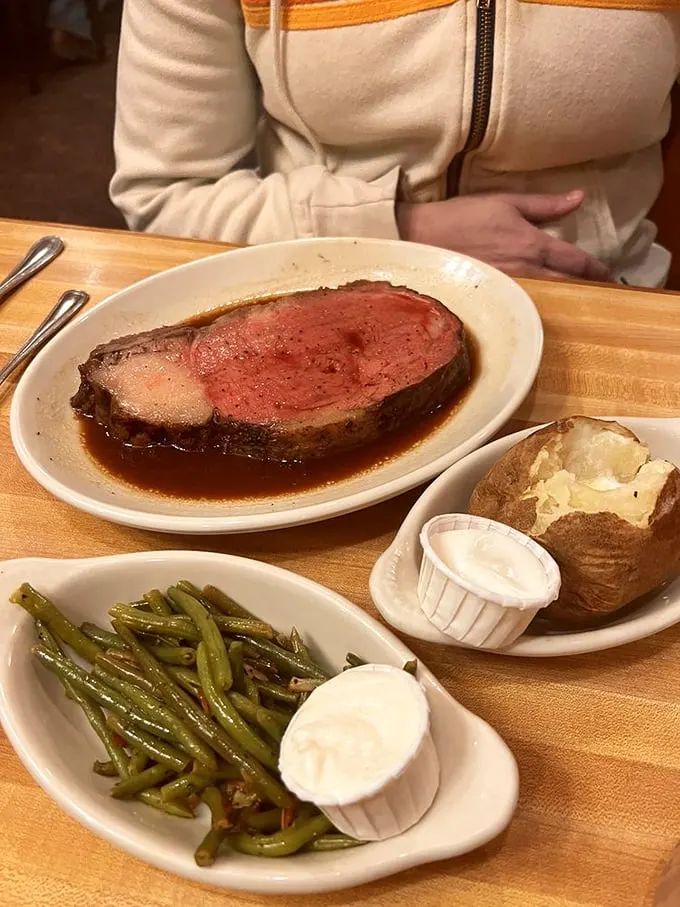 The star of the show in its natural habitat—prime rib so perfectly pink it could make a vegetarian question their life choices.