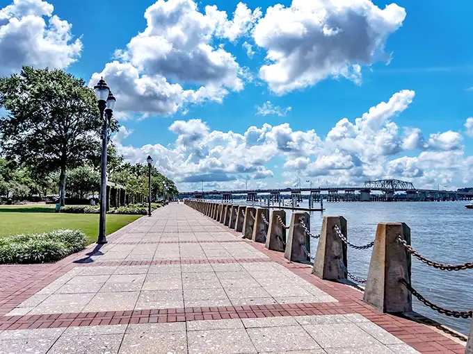 The waterfront promenade offers a front-row seat to Lowcountry magic, where river meets sky and benches invite you to pause and appreciate both.