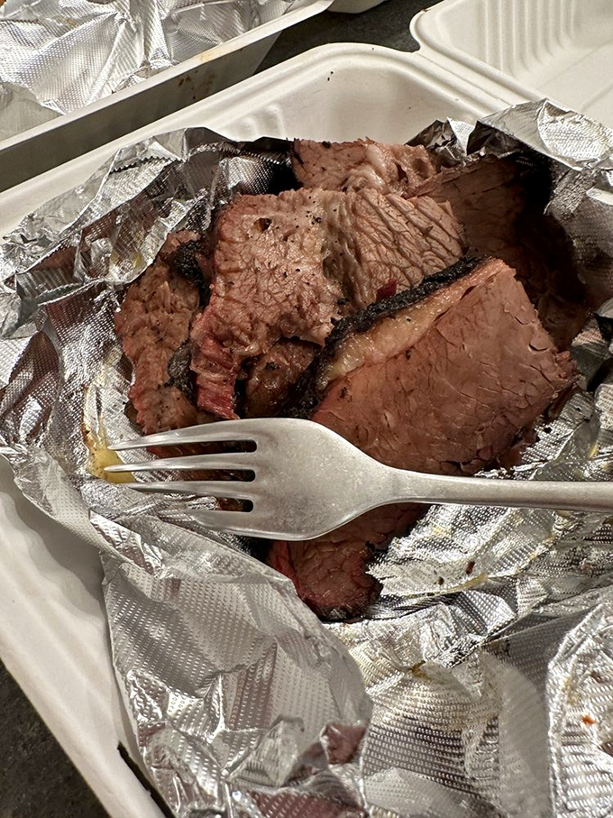 Behold the star of the show—brisket with a bark so perfect it deserves its own standing ovation.