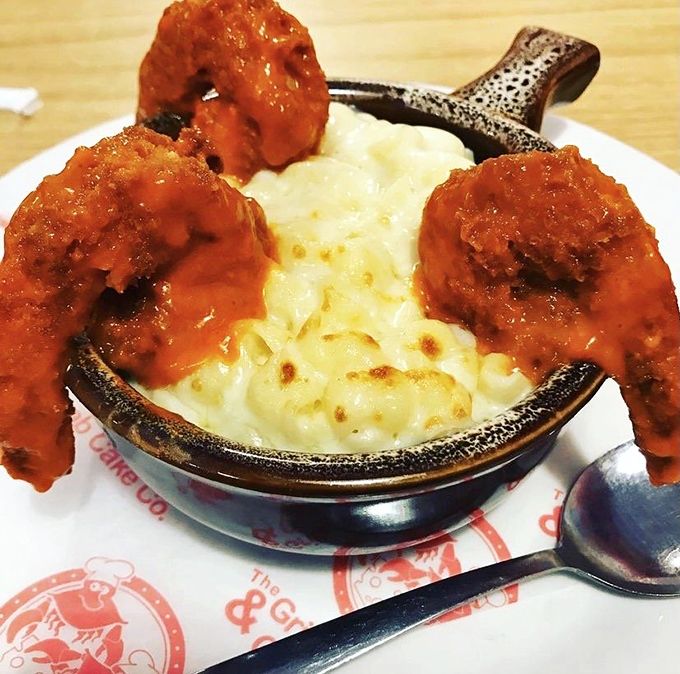 Buffalo shrimp perched atop creamy mac and cheese—proof that sometimes more is more. This dish doesn't whisper, it sings.
