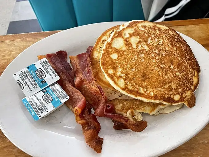 Golden-brown pancakes with that perfect crisp edge paired with bacon that's found the sweet spot between chewy and crisp. Breakfast nirvana achieved.