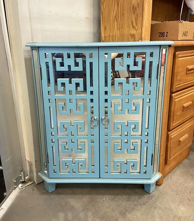 This turquoise geometric cabinet isn't just furniture—it's conversation-starting art that someone inexplicably parted with. Their design loss, your gain!
