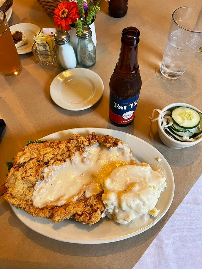 Behold the country-fried pork tenderloin smothered in creamy white gravy – a plate so good it makes you want to hug the chef and adopt Missouri citizenship.