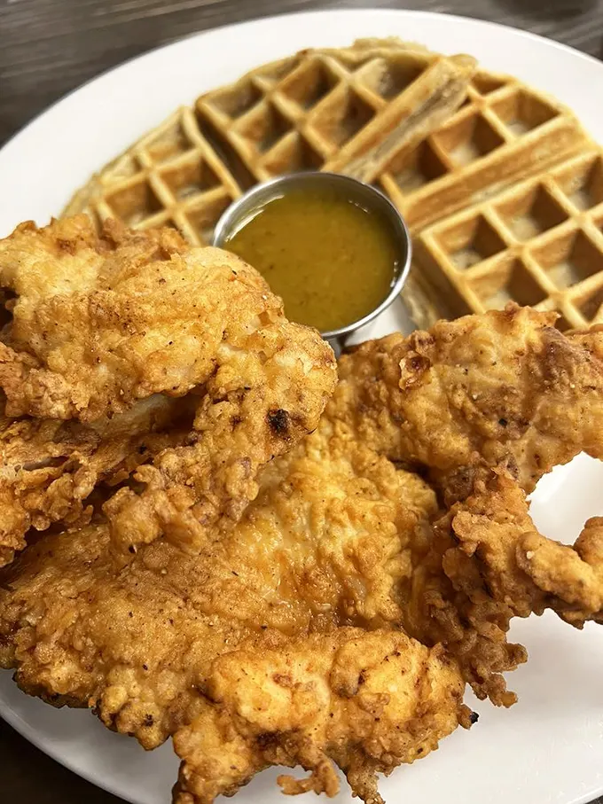 Not all heroes wear capes—some wear crispy batter atop golden waffles. The honey mustard sauce is the sidekick your taste buds never knew they needed.