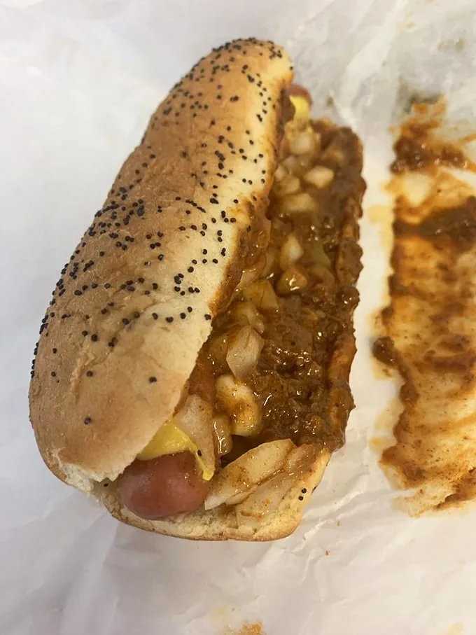 The poppy seed bun cradles that Vienna beef frank while homemade chili and diced onions create a harmony that Mozart would envy.