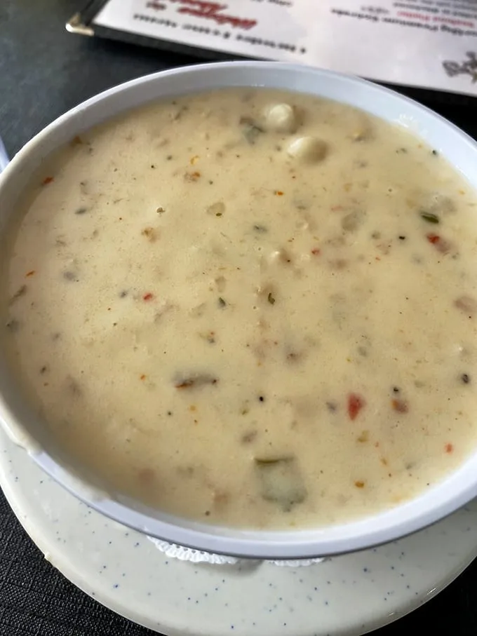 This isn't just soup—it's a creamy ocean symphony in a bowl. Each spoonful reveals tender clams and perfectly diced potatoes swimming in velvety perfection.