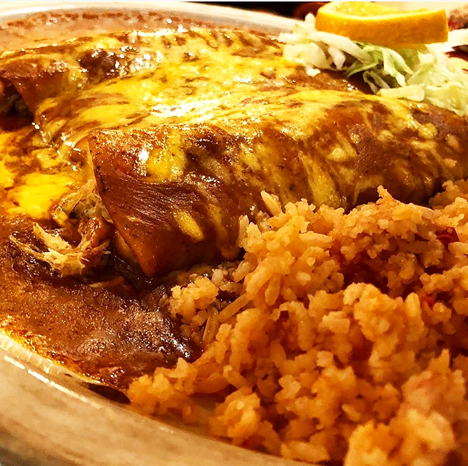 This classic enchilada plate proves good things come in simple packages. The rich sauce, perfectly cooked rice, and creamy beans create the holy trinity of Mexican comfort food.