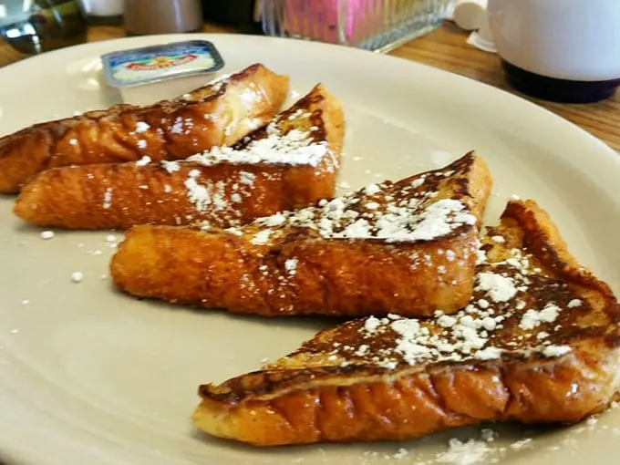 French toast that doesn't need a passport to impress. Golden-brown, dusted with powdered sugar, and ready for its close-up.
