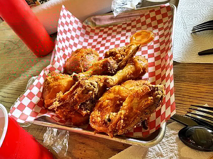 Golden-brown perfection served in a red checkered basket—this chicken doesn't need fancy plating when it has flavor this magnificent.