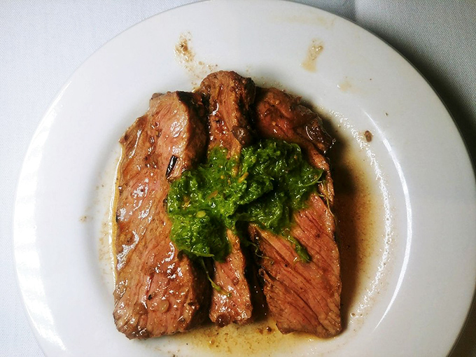 Steak this perfectly cooked doesn't need fancy plating—just a dollop of herb butter melting into those juicy fibers like nature intended.