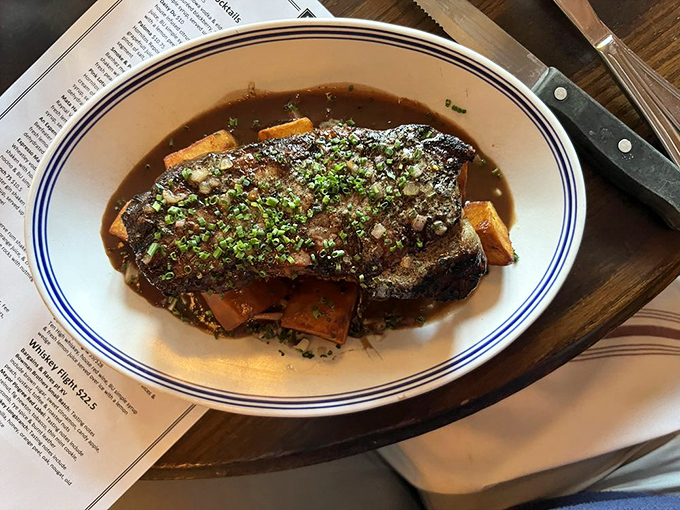This isn't just a steak—it's a masterclass in the art of beef. The sauce pool isn't for swimming, though you'll be tempted.